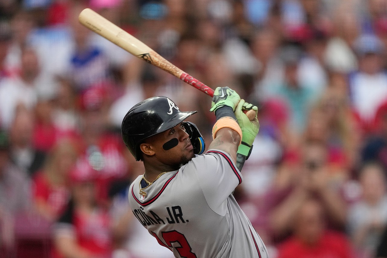 Ronald Acuña Jr. follows through and watches the ball after hitting a ...
