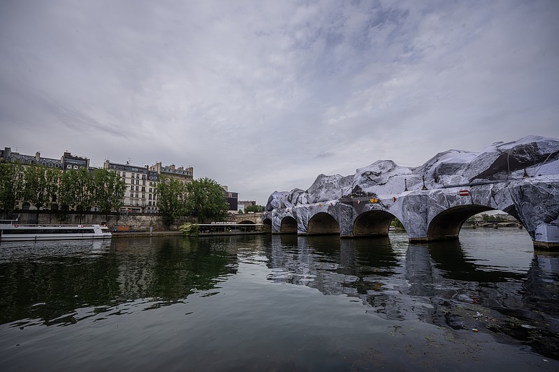 Monumental cave art on Paris' oldest bridge finally opens, as the ...