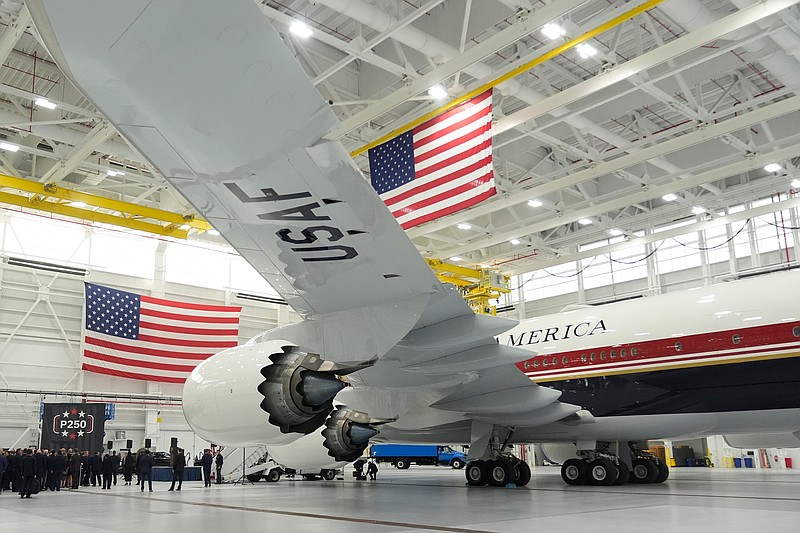 President Donald Trump unveils the new Air Force One, a converted ...