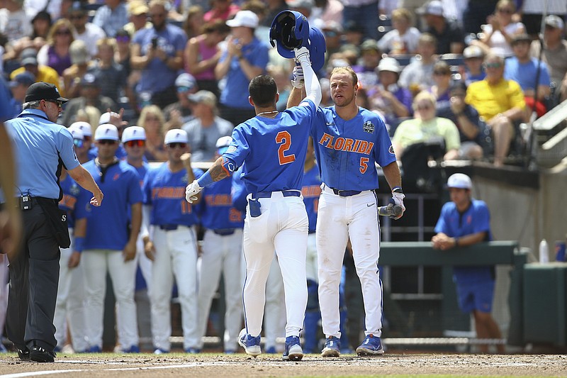 Florida sets CWS record, routs LSU to force third game in finals ...