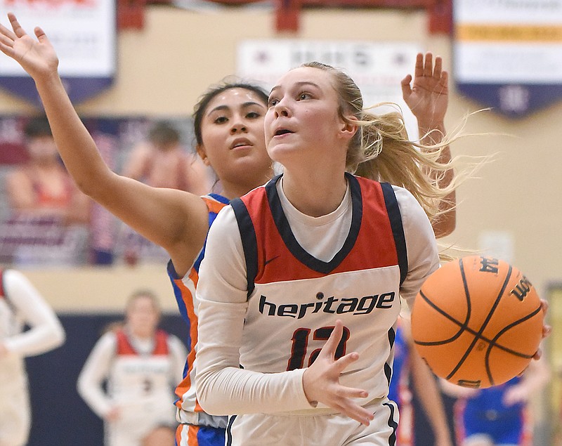Heritage girls close in on first regular season region basketball ...