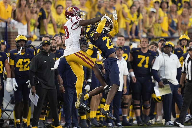 College football roundup: No. 18 Michigan beats No. 11 USC in back-and ...