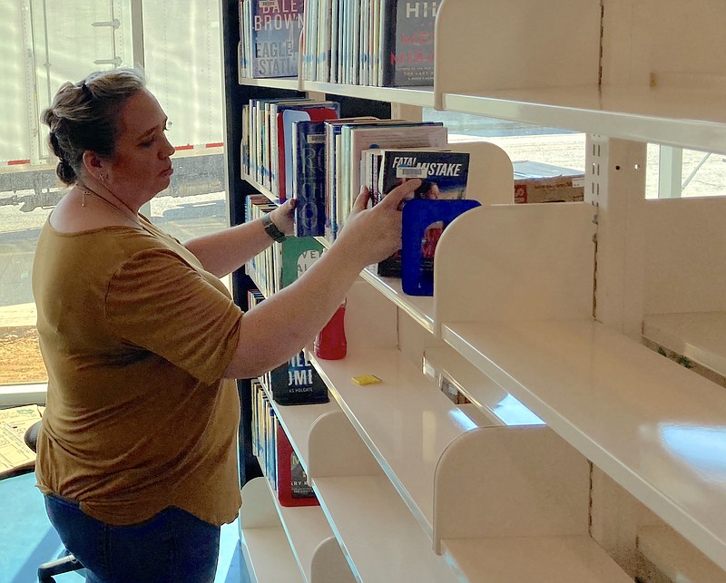 Librarian at top of long to-do list as new facility's opening nears ...
