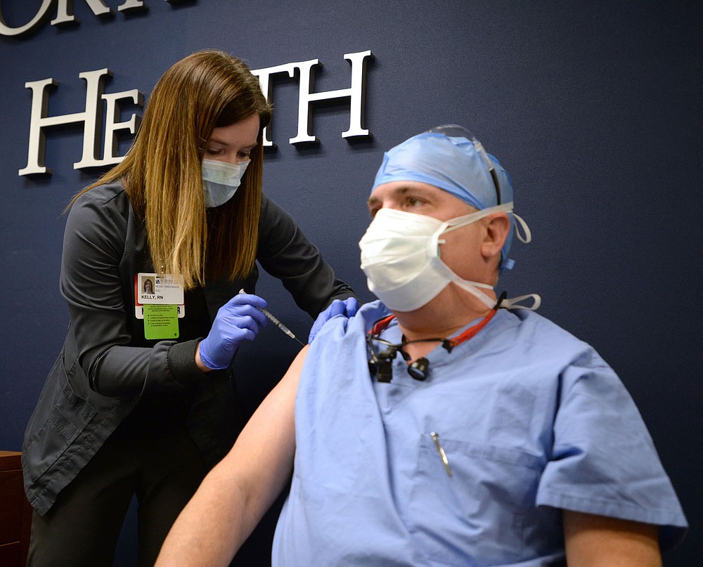 Hospitals begin vaccinating staff members against covid-19