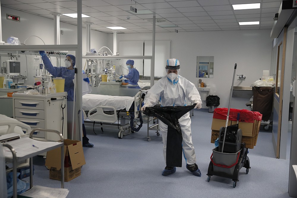 Unnoticed, cleaners do vital work in covid ICUs