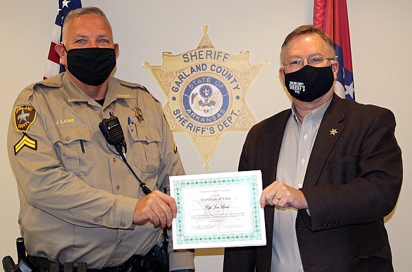 Sheriff's deputy honored for valor in saving woman from her burning house