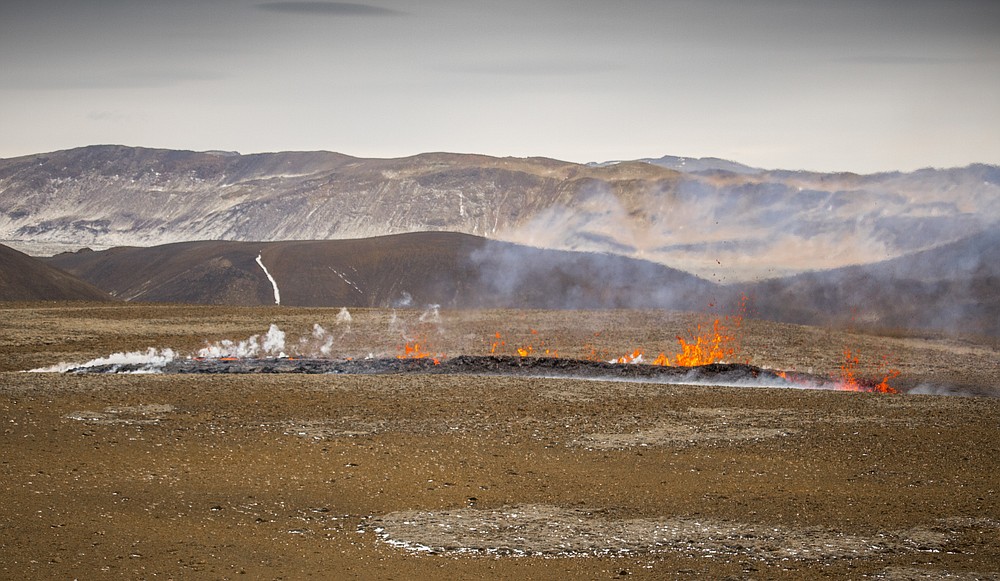 Hikers scramble as new fissure opens up at Icelandic volcano