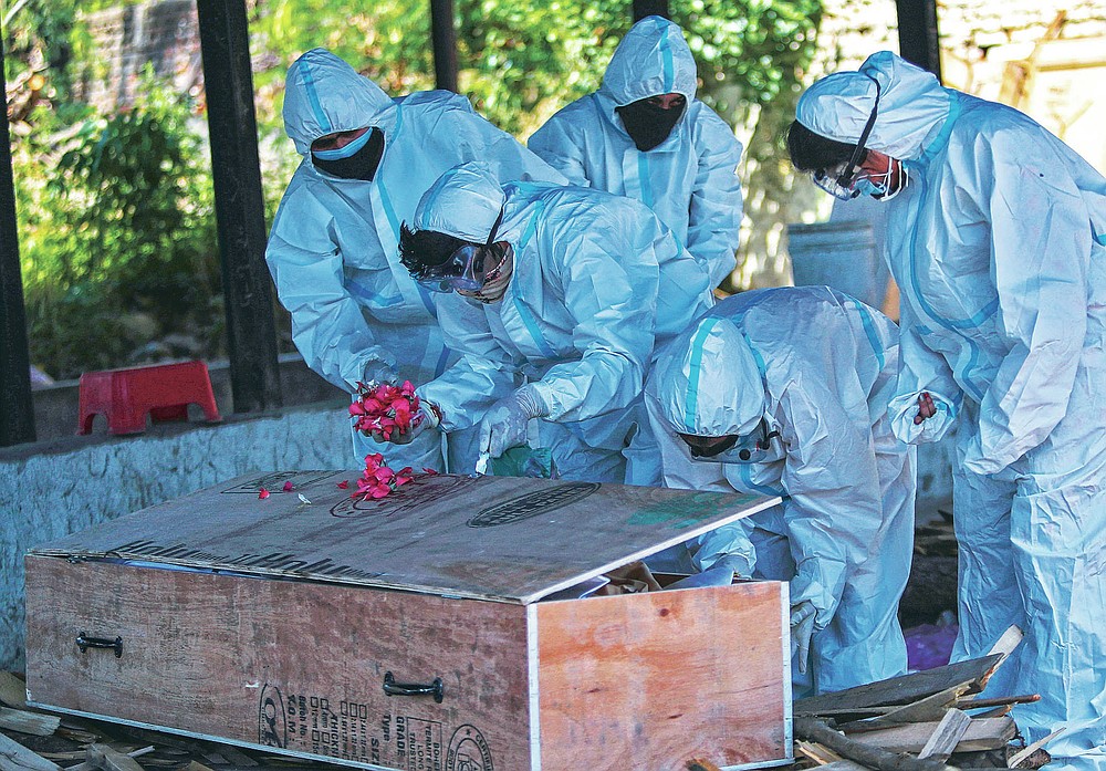 Overwhelmed: Mass funeral pyres reflect India's covid crisis