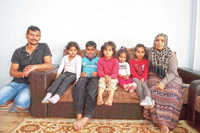 Syrian family reunited, against the odds, in Greece