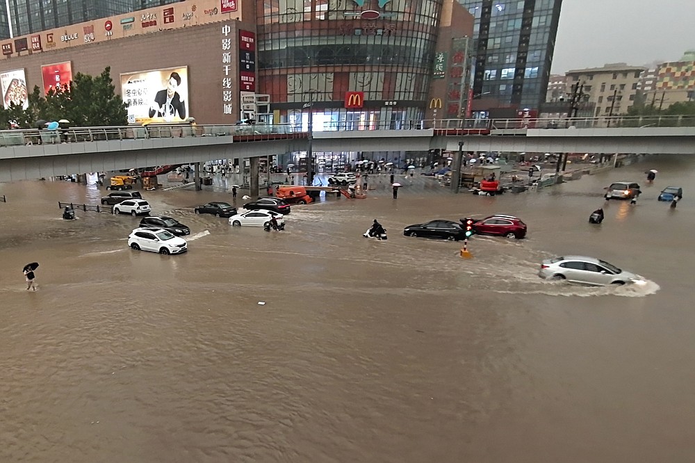 China blasts dam to divert floods that killed at least 25