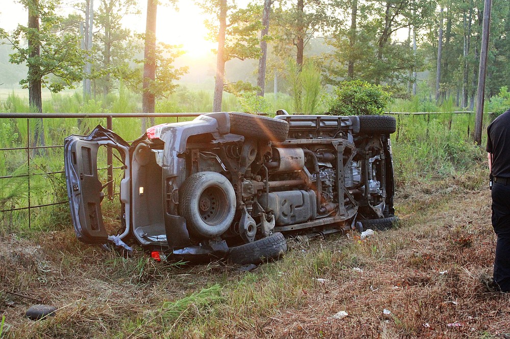 Broken axle causes rollover outside Smackover