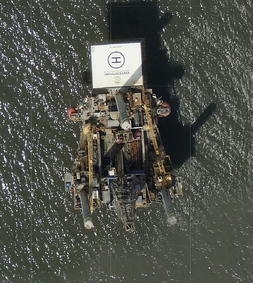 Photos show black slick in water near Gulf oil rig