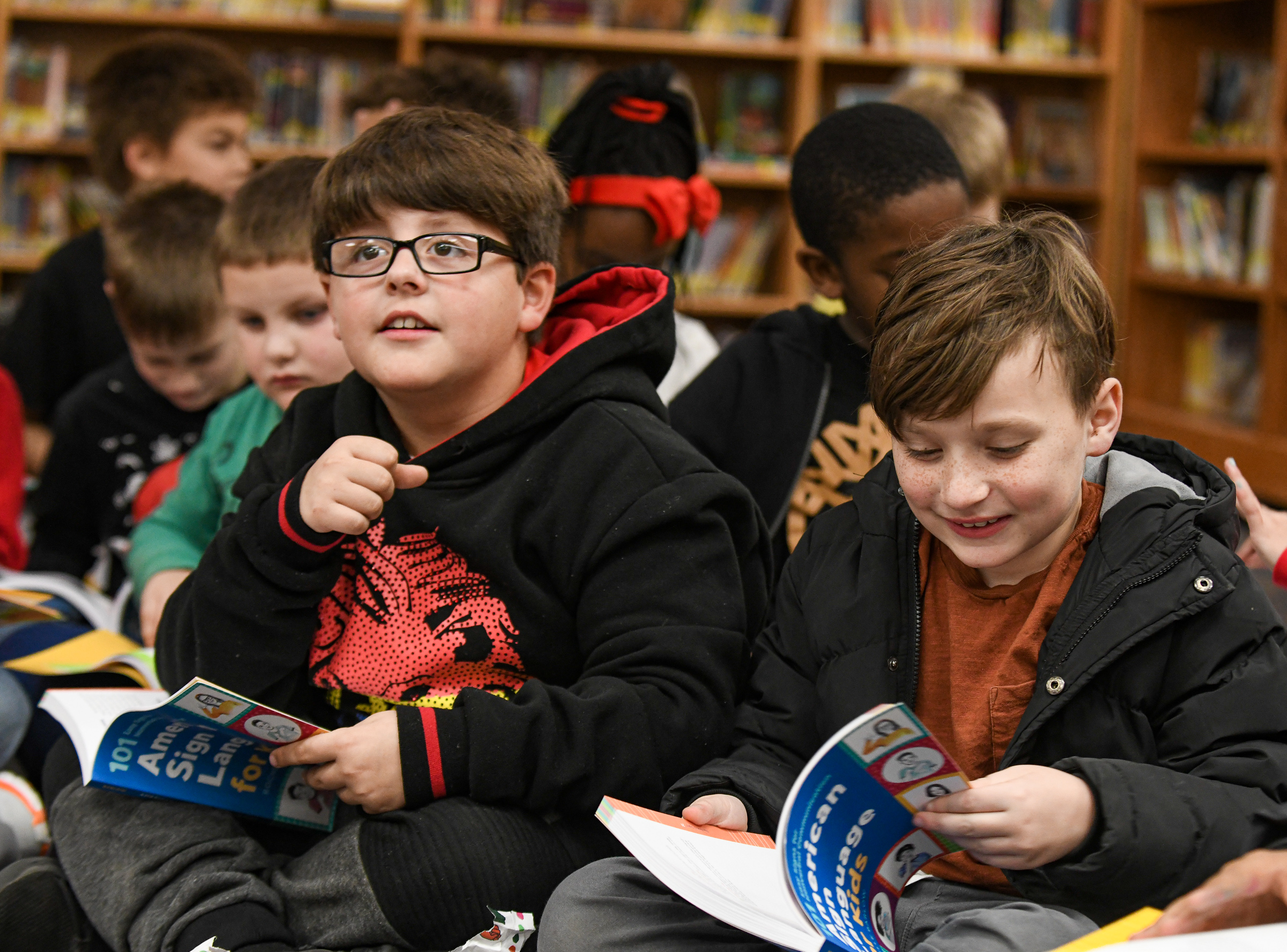 Gift of sign language books helps foster communication, learning among ...