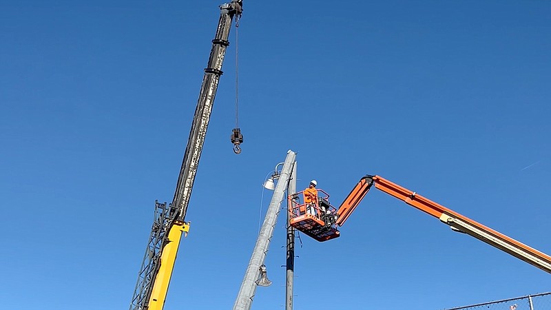 WATCH: Crews remove storm-damaged stadium lights | Hot Springs Sentinel ...