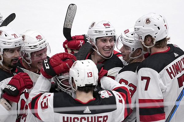 Hughes scores winner in OT to lead Devils past Stars 3-2