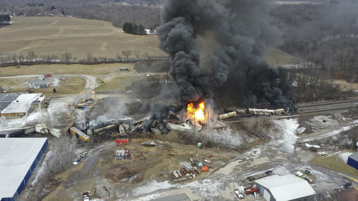 Emergency crews release toxic chemicals from five derailed tanker cars ...