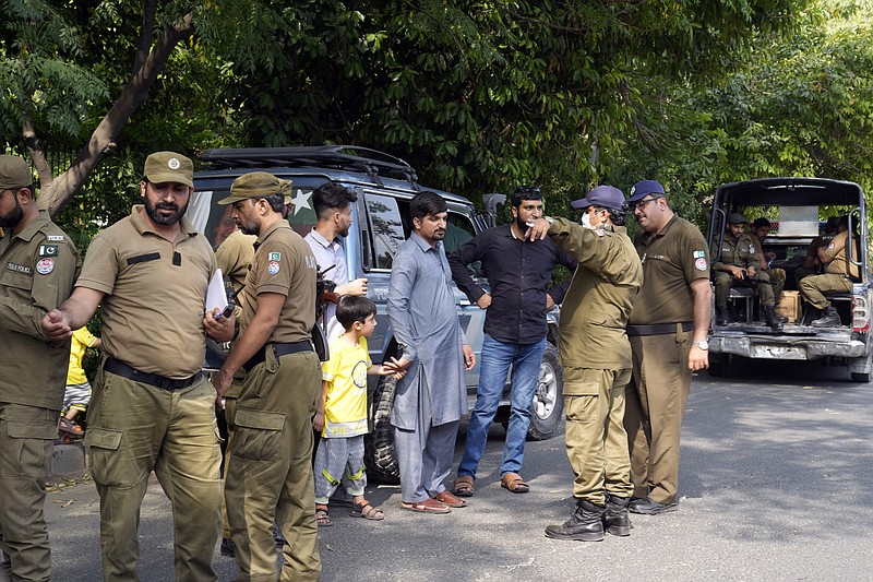 Pakistani police surround Khan’s home, claim he’s hiding suspects in ...