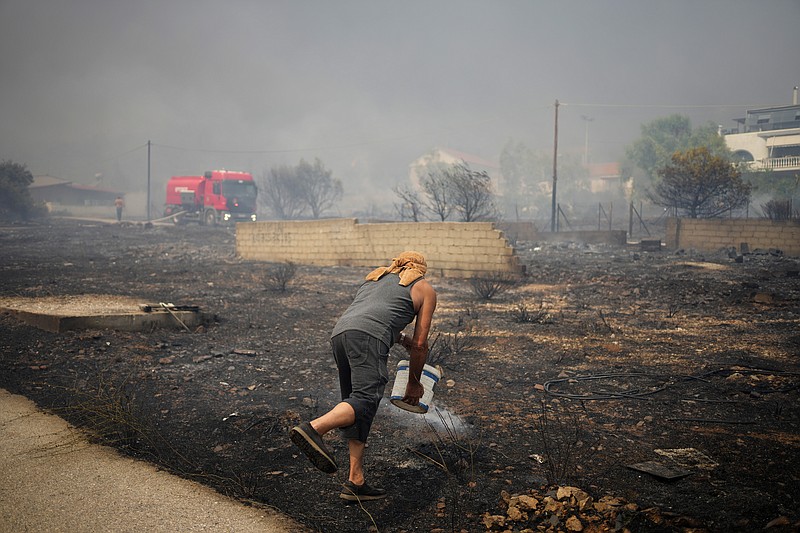 Wildfires that have left 20 dead in Greece burn out of control ...