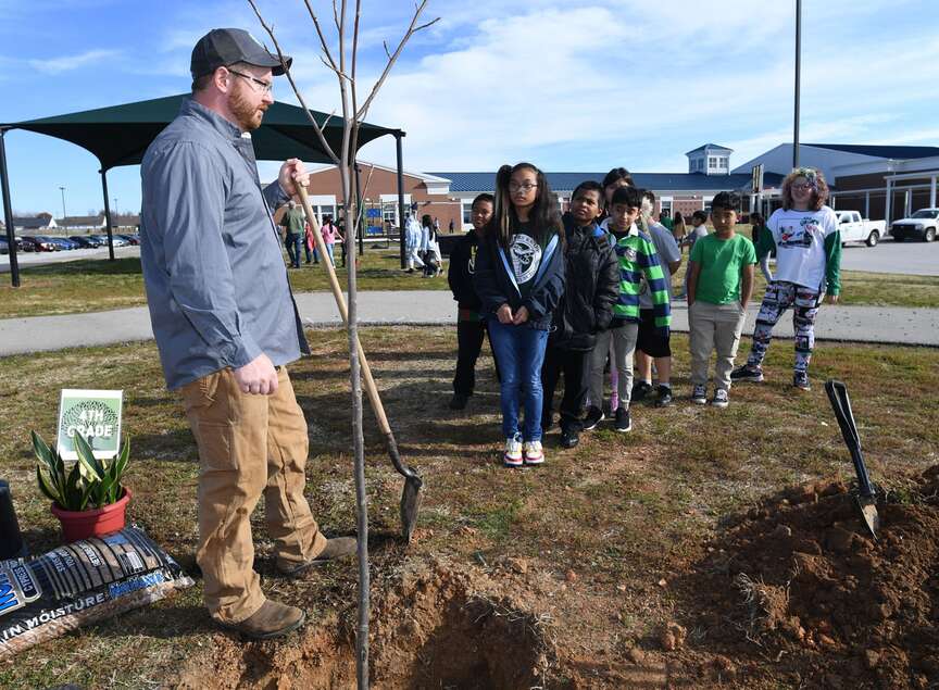 Branching out: Knapp Elementary School students help plant trees to ...