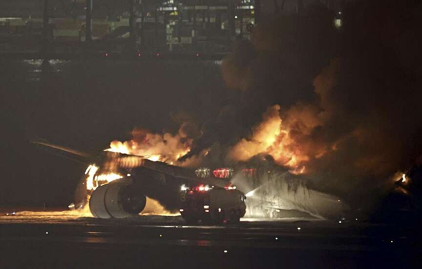 Passenger jet, Japanese coast guard plane collide, catch fire at Japan ...