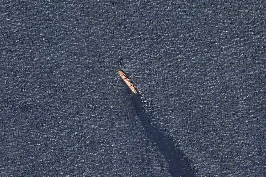 Sinking cargo ship leaves oil spill, fertilizer leak, highlighting ...