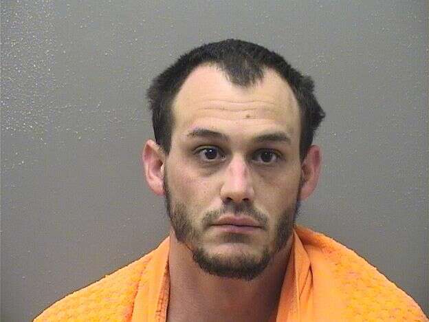 Two arrested on gun, drug charges after getting stuck at storage ...