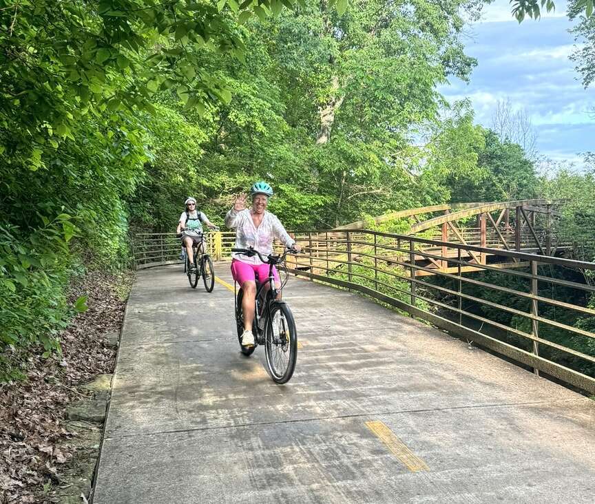 Bikers of all ages enjoy a pleasant tour along the Razorback Greenway ...