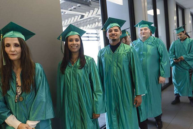Ten adults receive high school diplomas as part of first graduating ...