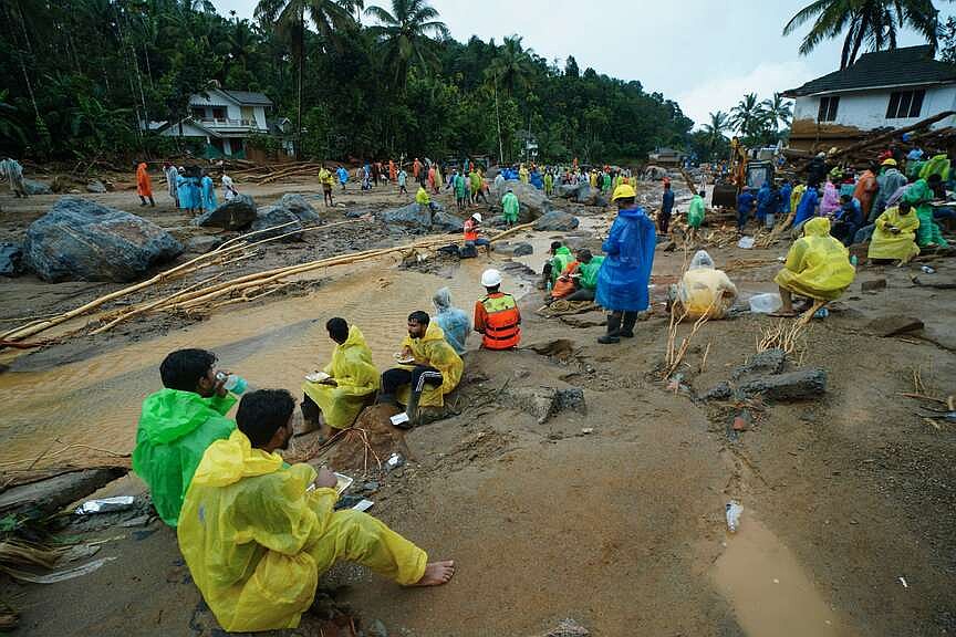 In southern India, rescuers search through mud and debris as deaths ...