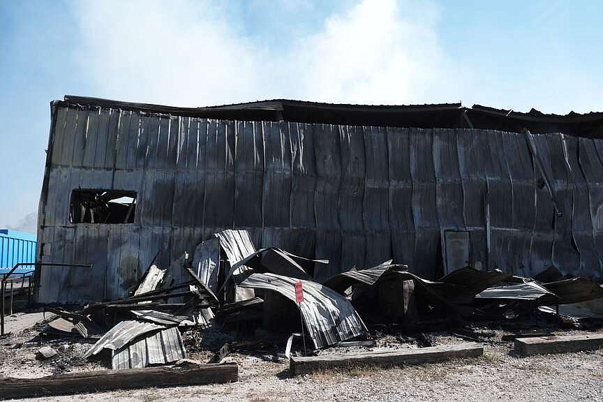 Questions about air quality, initial cause remain as Rogers fire ...