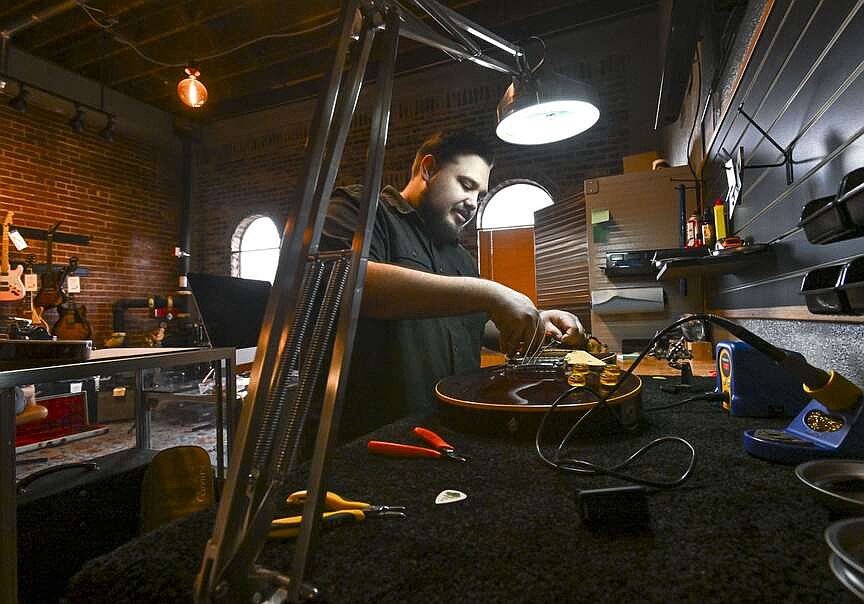 PHOTOS: Music company works on and sells instruments in downtown Fort ...