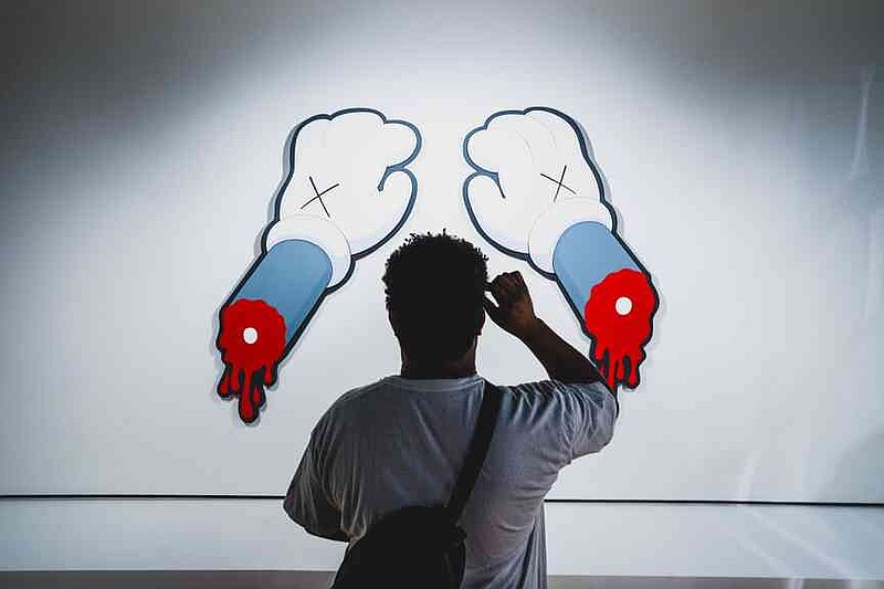 Artist known as KAWS brings whimsical work to Crystal Bridges | The ...