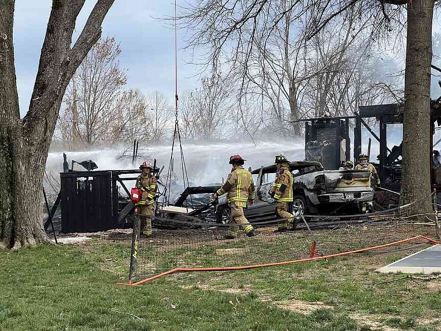 Bentonville firefighters battle house fire with assistance from Bella ...