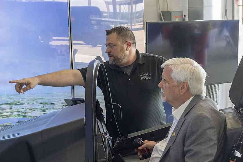 Military and civilian officials celebrate graduation of first pilots ...