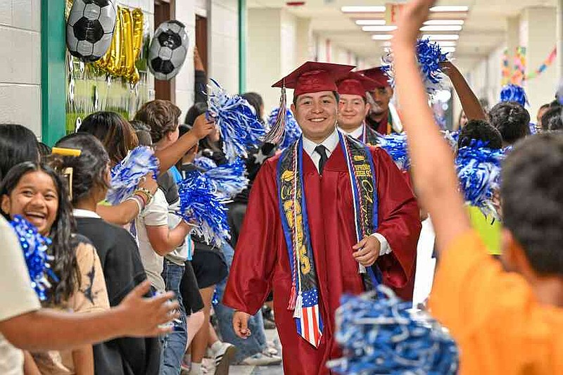 PHOTOS: Graduating seniors return to their elementary schools in ...