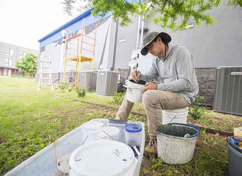 PHOTOS: Jason Jones works on new mural in Fayetteville | Northwest ...