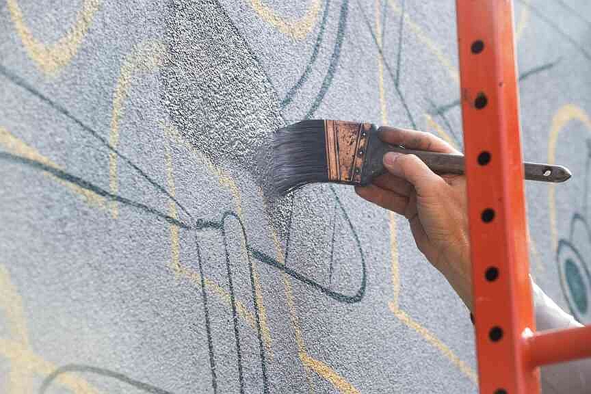 PHOTOS: Jason Jones works on new mural in Fayetteville | The Arkansas ...