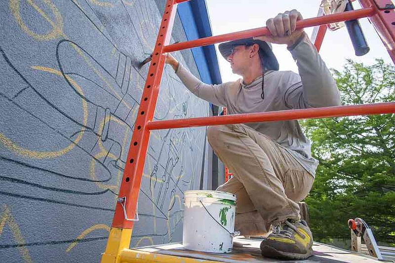 PHOTOS: Jason Jones works on new mural in Fayetteville | Northwest ...