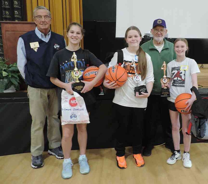 Winners in the 12- and 13-year-old girls category are Grace King, left ...