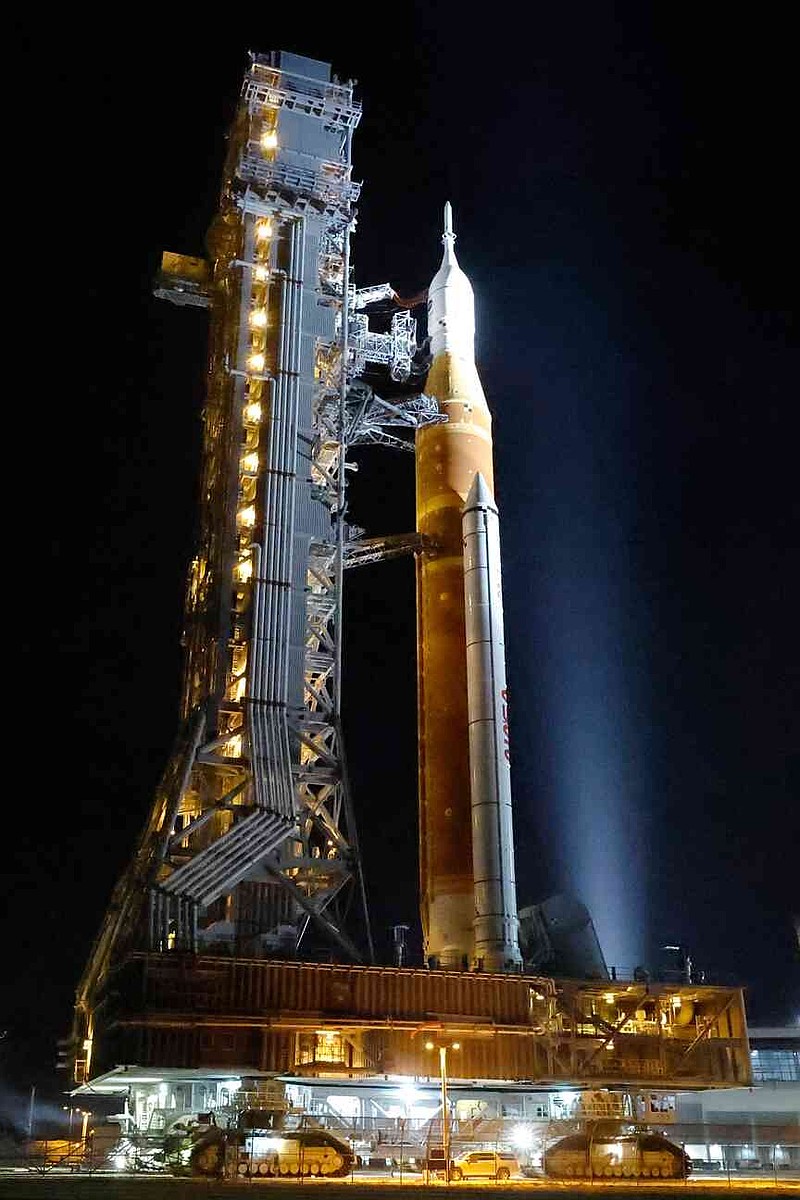 NASA hauls its repaired moon rocket from the hangar back to the pad for ...