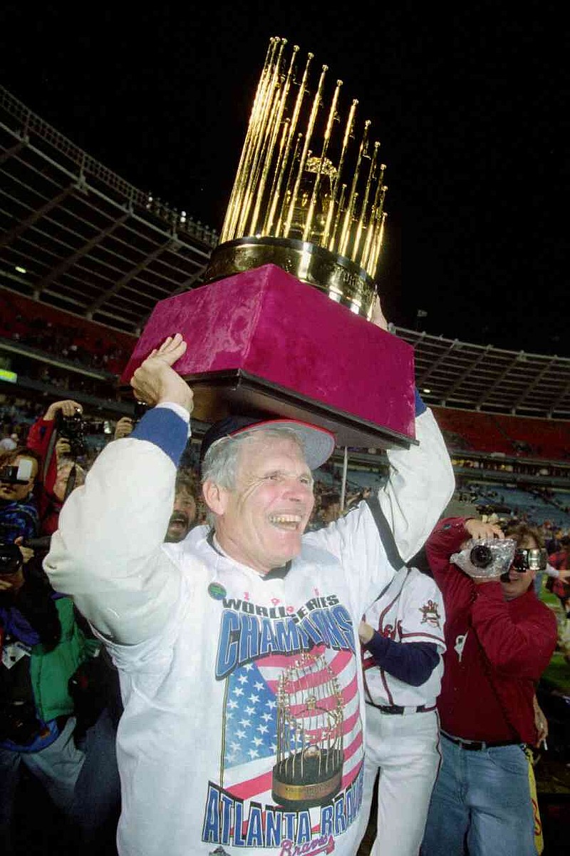 FILE - Atlanta Braves owner Ted Turner holds up the World Series trophy ...