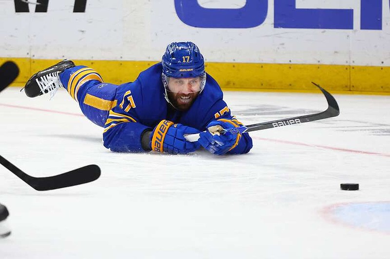 Buffalo Sabres left wing Jason Zucker is tripped during the first ...