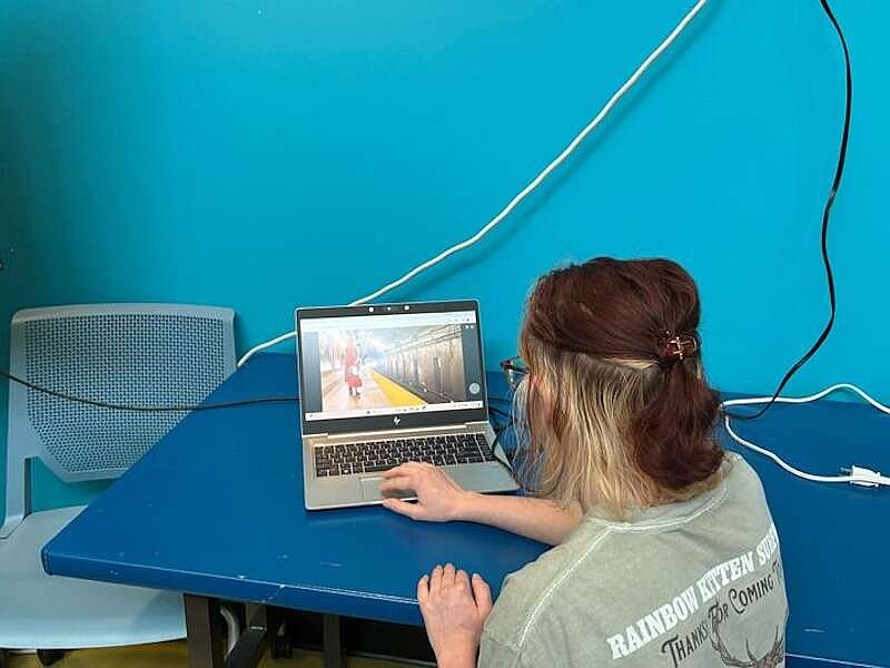 Caitlin Covey, a clerk at the Garland County Library, demonstrates ...