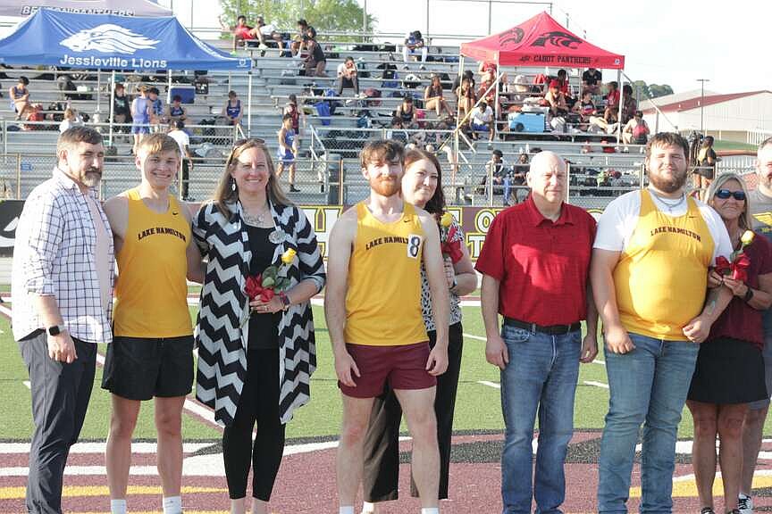 Lake Hamilton track seniors stand with their parents at Wolf Stadium ...