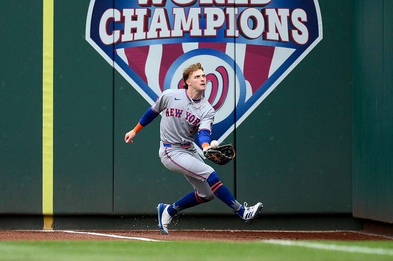 New York Mets right fielder Carson Benge tries to get to a ball popped ...