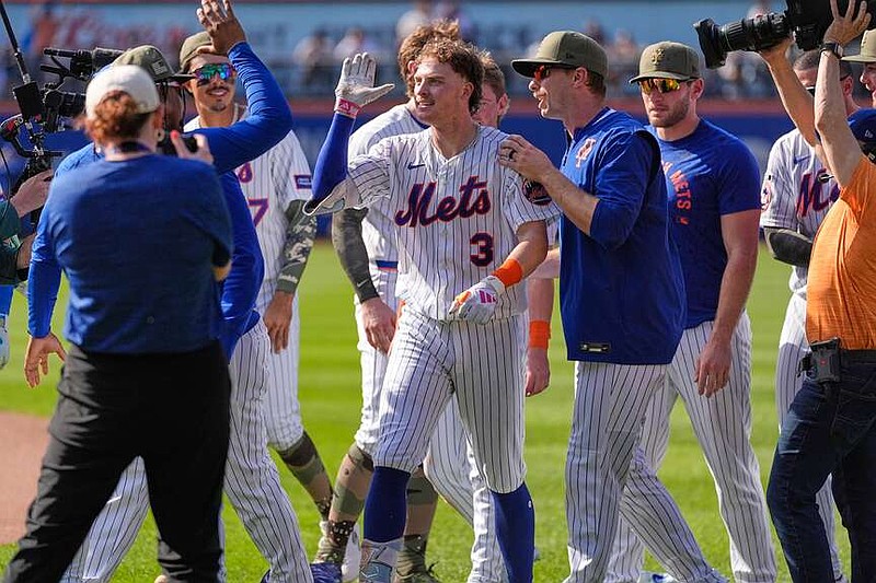 New York Mets' Carson Benge, center, celebrates with teammates after he ...
