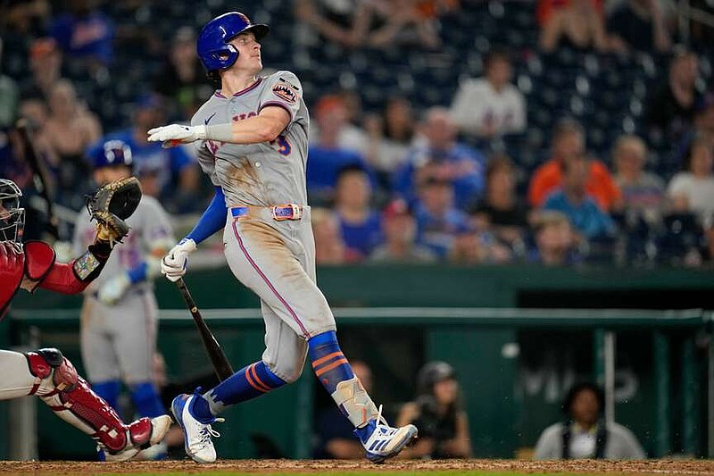 New York Mets' Carson Benge follows through his swing as he hits a two ...