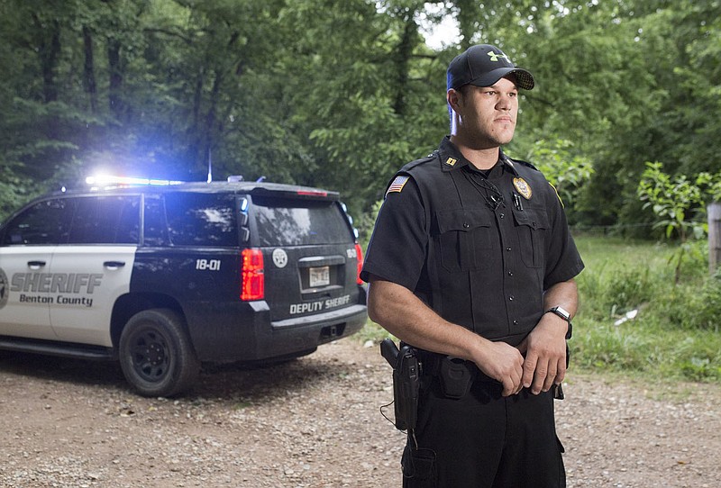 Capt. Chris Kelley, then of the Gravette Police Department, speaks ...