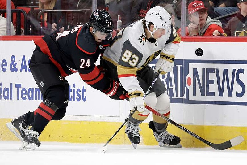 FILE - Carolina Hurricanes center Seth Jarvis (24) and Vegas Golden ...