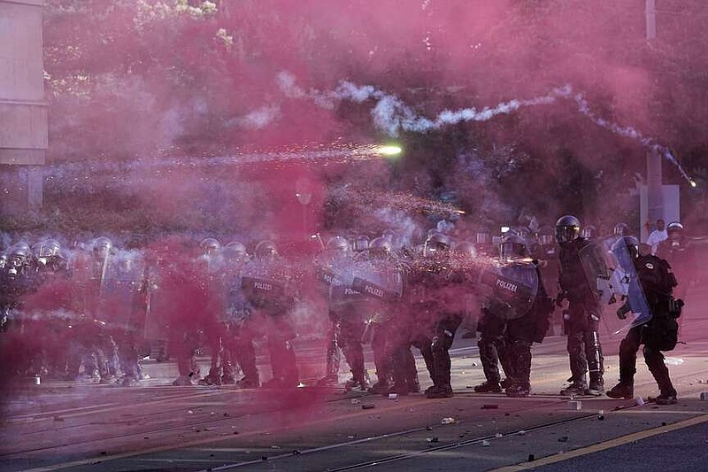 Riot police, protesters clash in Geneva | The Arkansas Democrat-Gazette ...